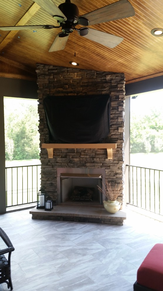 Custom stone fireplace with stainless gas insert and porcelain tile ...
