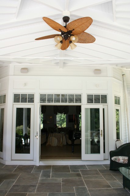 New porch with exposed rafters creates lovely outdoor entertaining area ...