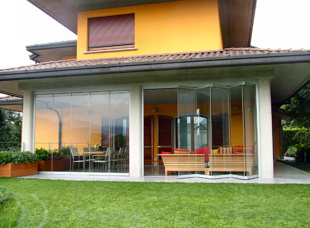 Patio closed off with folding glass doors, water and airproof ...