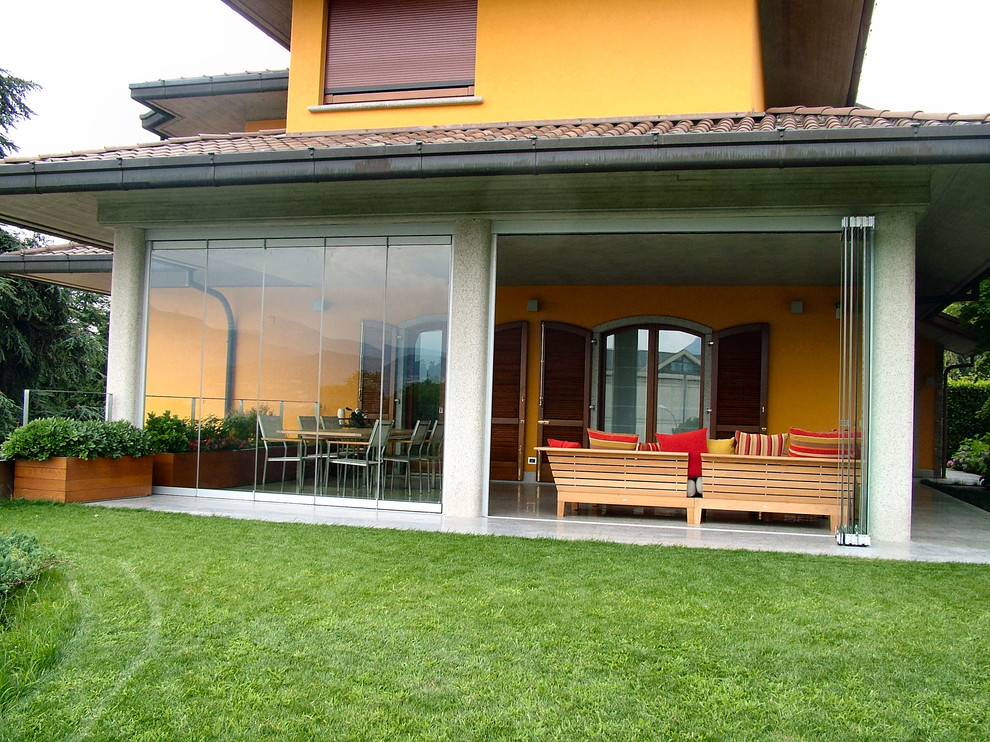 Patio closed off with folding glass doors, water and airproof ...