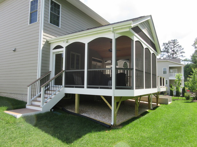 Porch is complete with gable roof and vinyl arched trim - Traditional ...