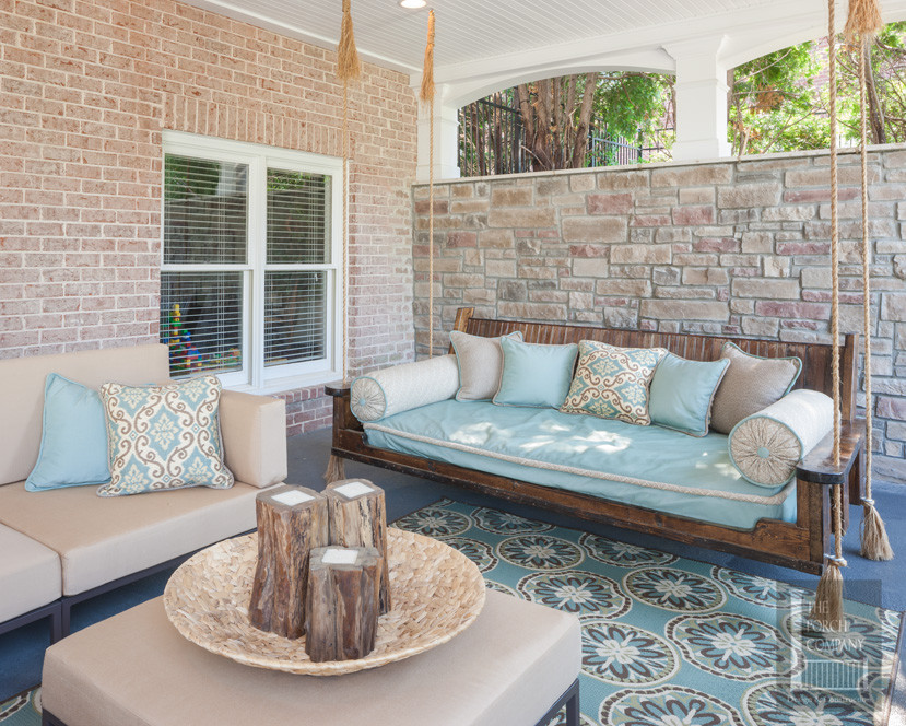 Two story double porch with outdoor fireplace, travertine patio, and ...