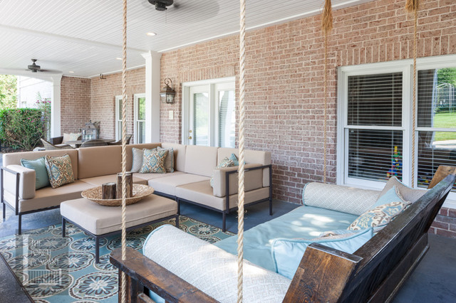 Two story double porch with outdoor fireplace, travertine patio, and ...