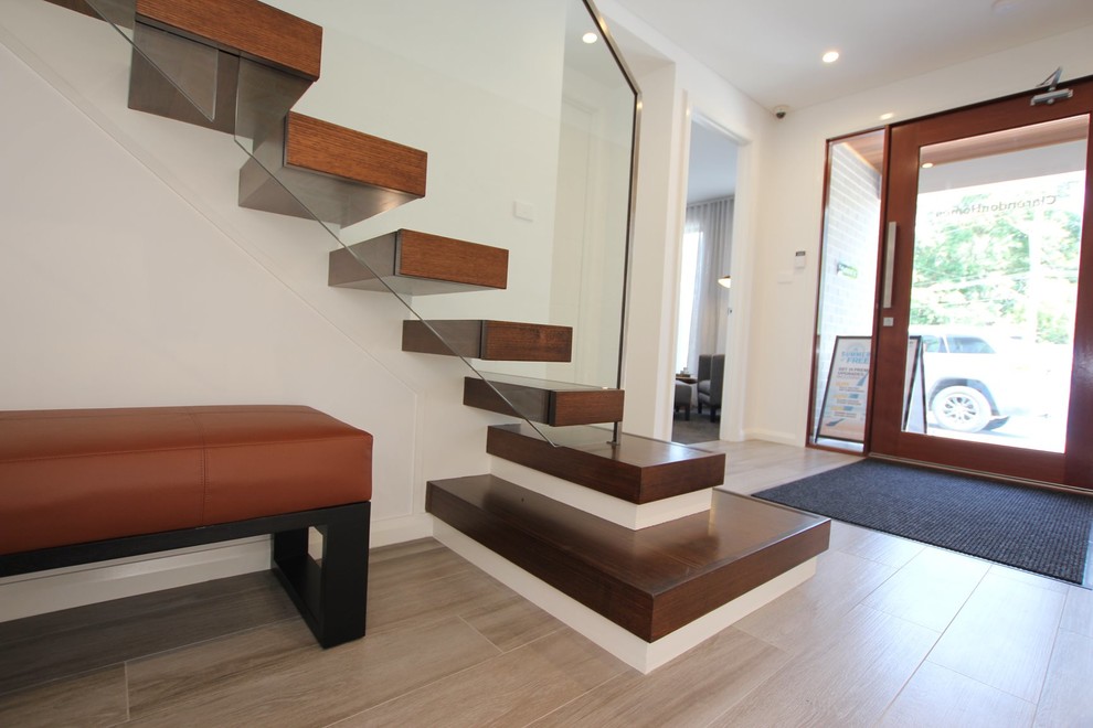 Cantilevered timber staircase with modern style semi-frameless glass ...