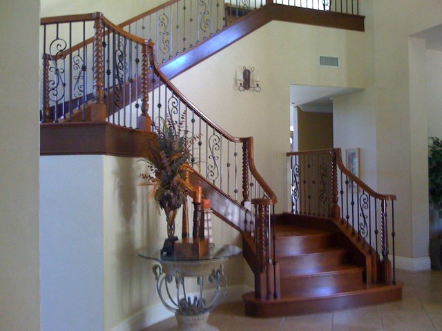 Custom Curved Maple Staircase with Iron Balusters - Traditional ...