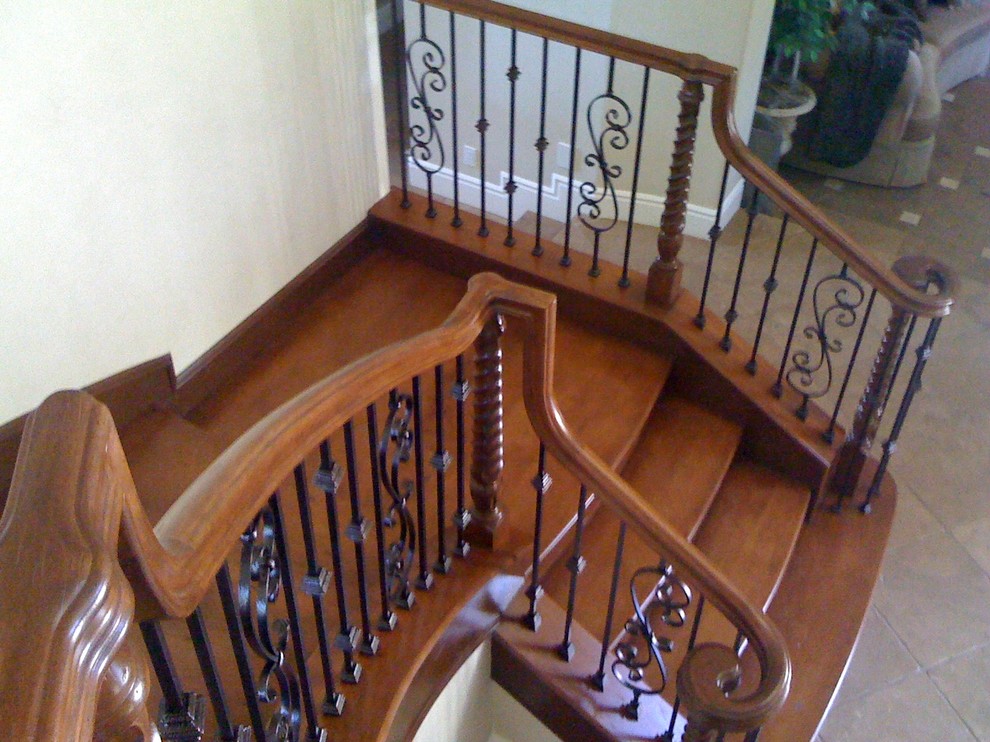 Custom Curved Maple Staircase with Iron Balusters - Traditional ...