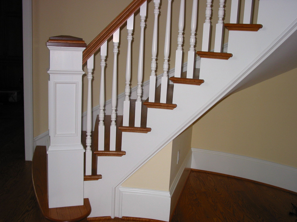 Custom Sweeping Staircase with Wood Spindles - Traditional - Staircase ...