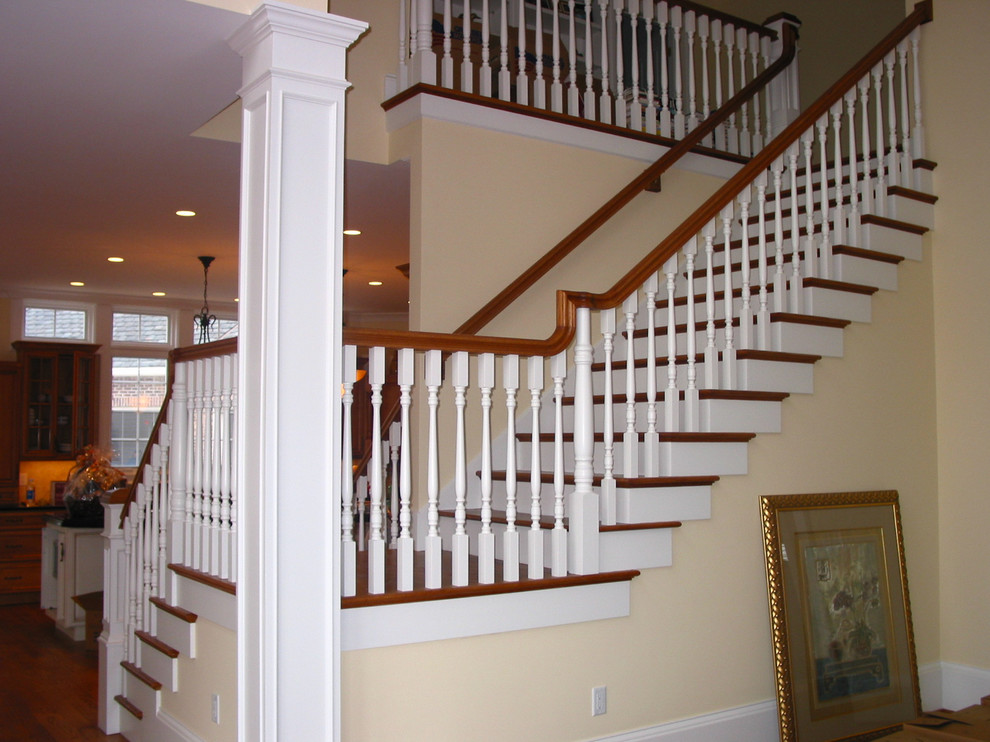 Custom Sweeping Staircase with Wood Spindles - Traditional - Staircase ...