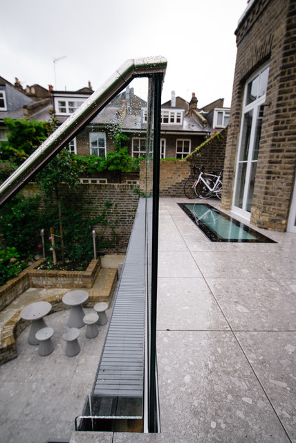 External Open Riser stairs with perforated treads and glass balustrade ...