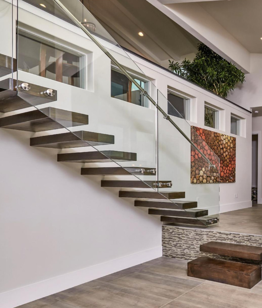 Floating iron stair with glass railings - Contemporary - Staircase ...