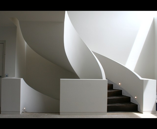 Geometric curved stair with curved dwarf wall balustrade - Modern ...