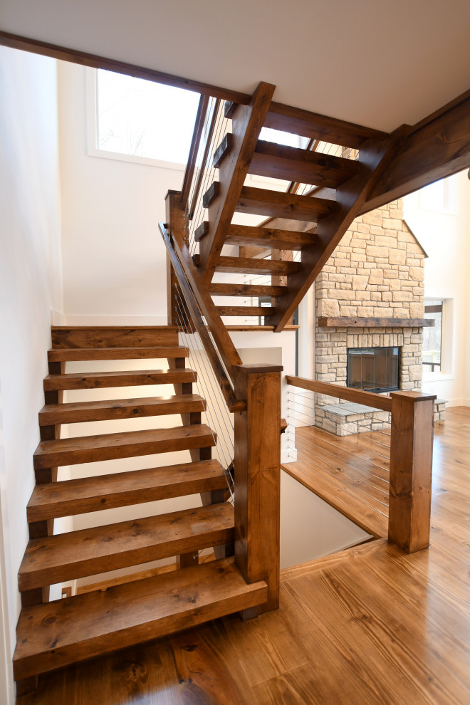 Modern country staircase features steel cable rails. - Farmhouse ...