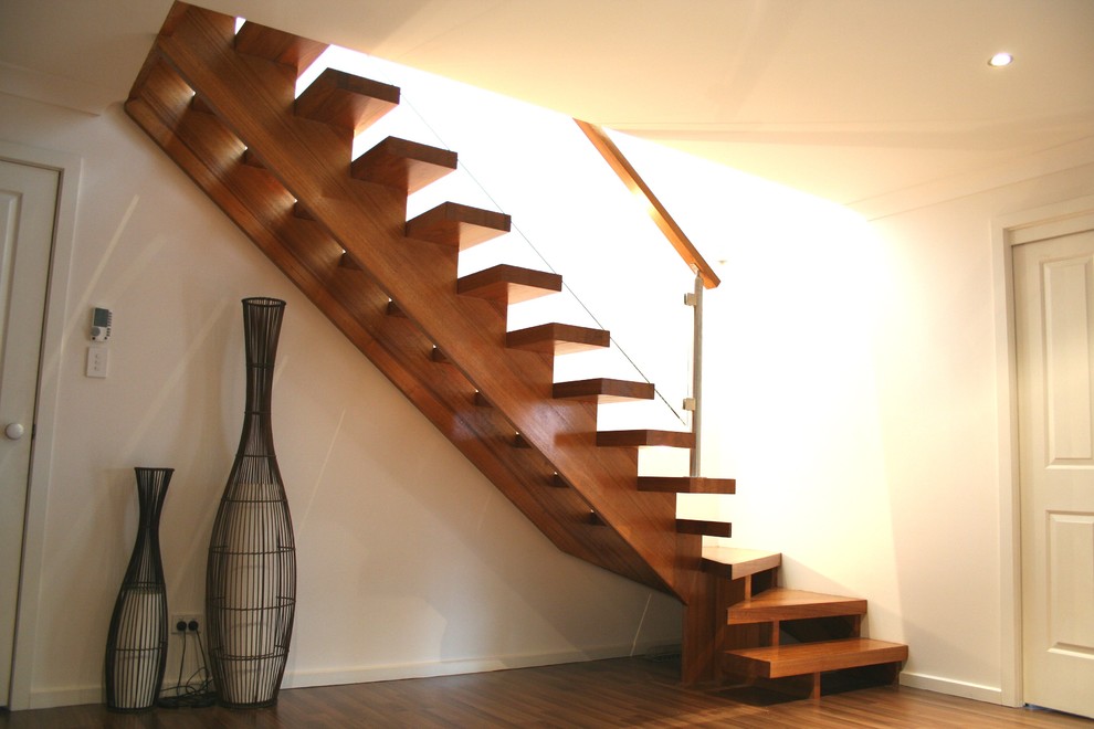 Open cantilevered stair with Split cut strings and glass balustrade ...