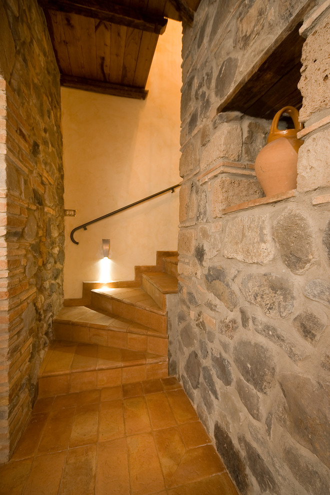 Photo of rustic handmade terracotta tiles and stone walls - Rustic ...