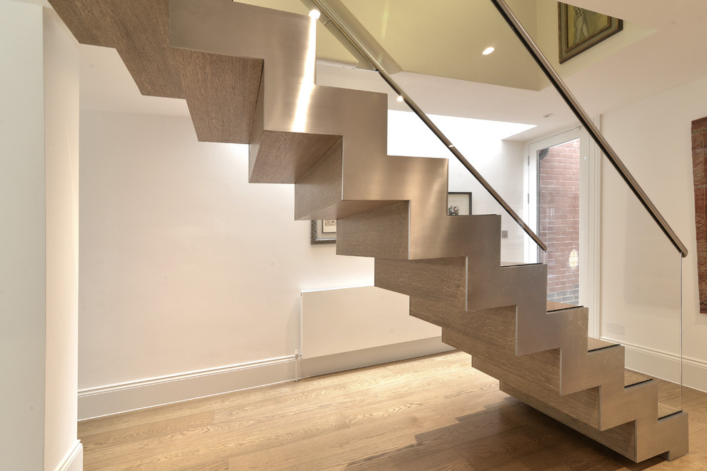 Two straight stairs with offset cantilever timber treads and glass ...