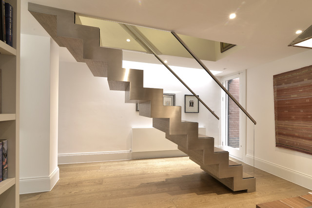 Two straight stairs with offset cantilever timber treads and glass ...