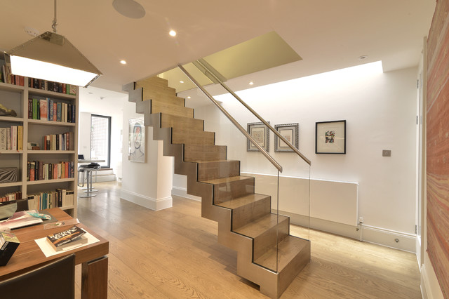 Two straight stairs with offset cantilever timber treads and glass ...