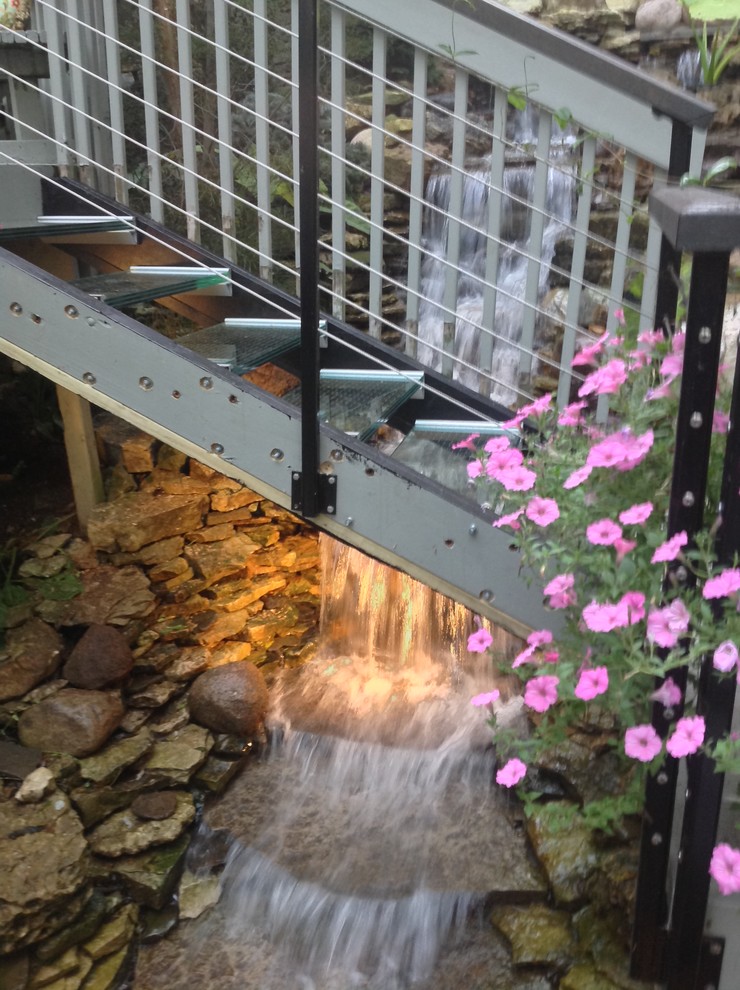 Waterfall in a landscape design with glass steps - Traditional ...
