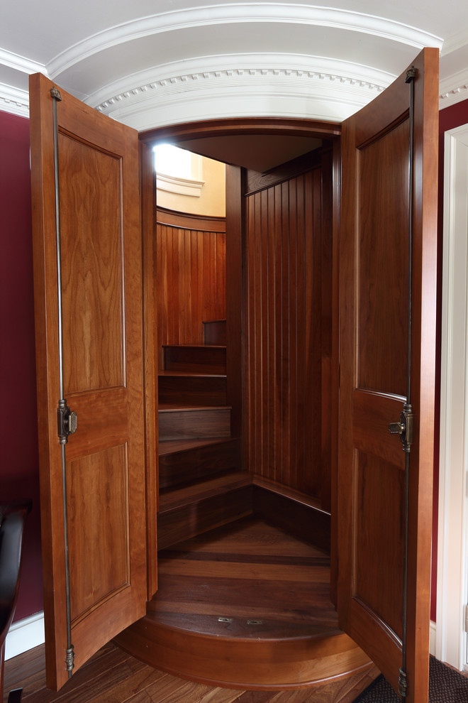 wooden spiral staircase with custom curved doors - Traditional ...