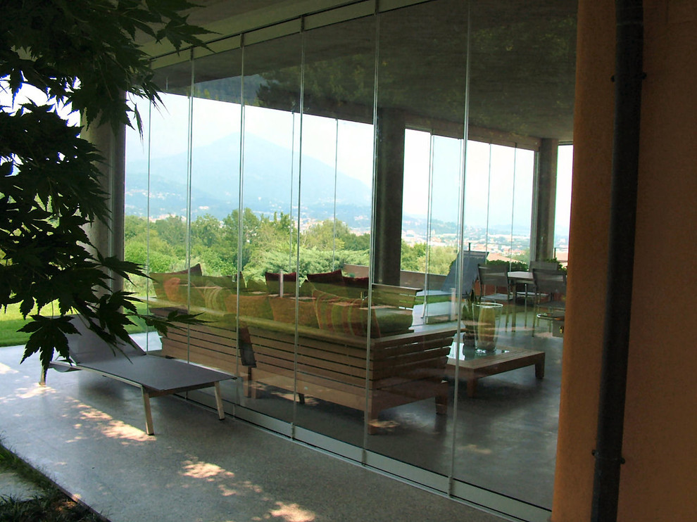 Patio closed off with folding glass doors, water and airproof ...